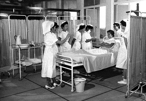 Nurses during a training session, with one of them on the