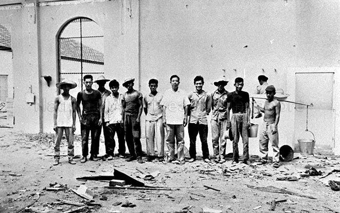GROUP OF WORKERS DOING DEMOLITION WORK AT OUTRAM ROAD PRISON