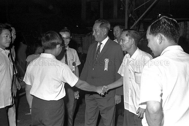 DEPUTY PRIME MINISTER DR TOH CHIN CHYE IS BEING GREETED WHEN