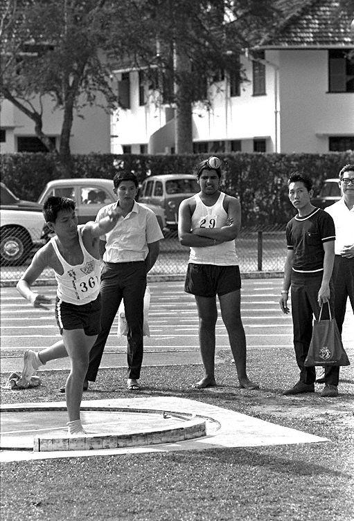 An athlete competing in a shot put event during the Inter-
