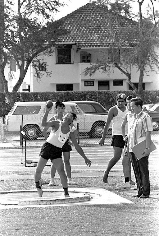 An athlete competing in a shot put event during the Inter-