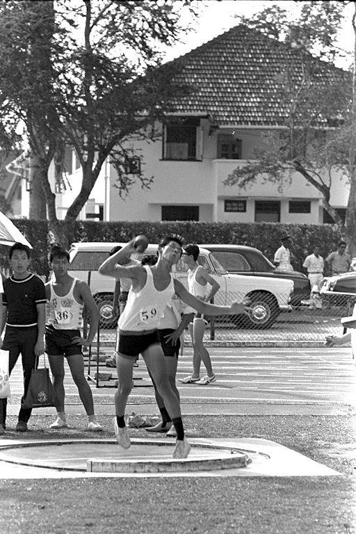 An athlete competing in a shot put event during the Inter-