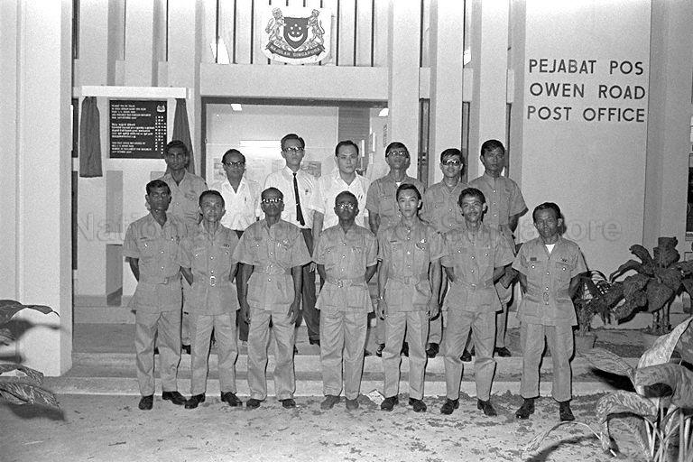 Group photo of staff, taken at the opening of Owen Road Post