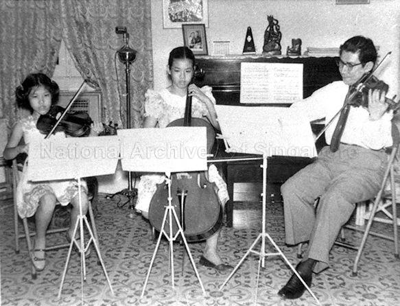 GOH SOON TIOE WITH DAUGHTERS VIVIEN ON THE VIOLIN AND SYLVIA