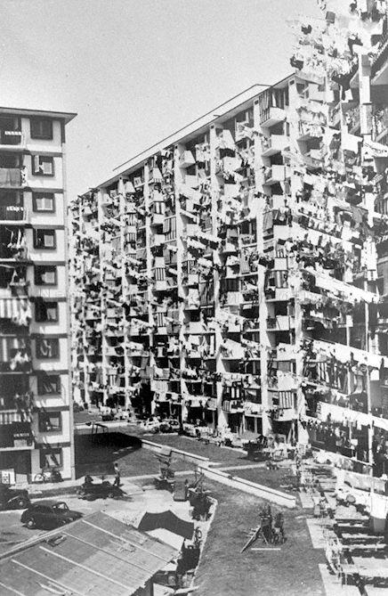 BUKIT HO SWEE ESTATE: WASHING BEING HUNG OUT ON BACK
