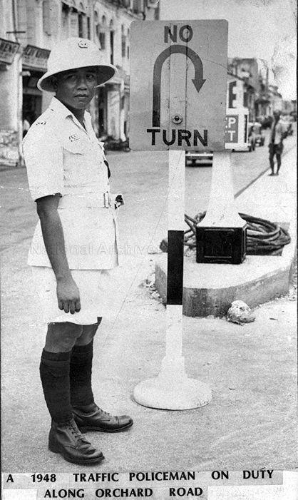 TRAFFIC POLICEMAN ON DUTY ALONG ORCHARD ROAD