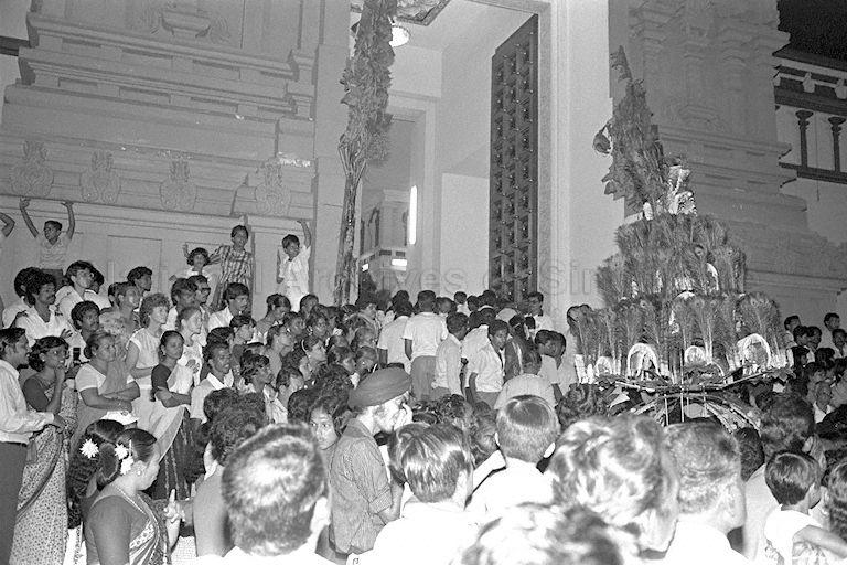 Devotees and kavadi carriers during Thaipusam celebrations