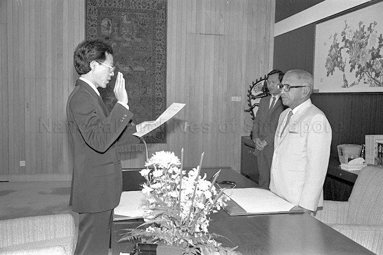 President C V Devan Nair (right) officiating at the Swearing