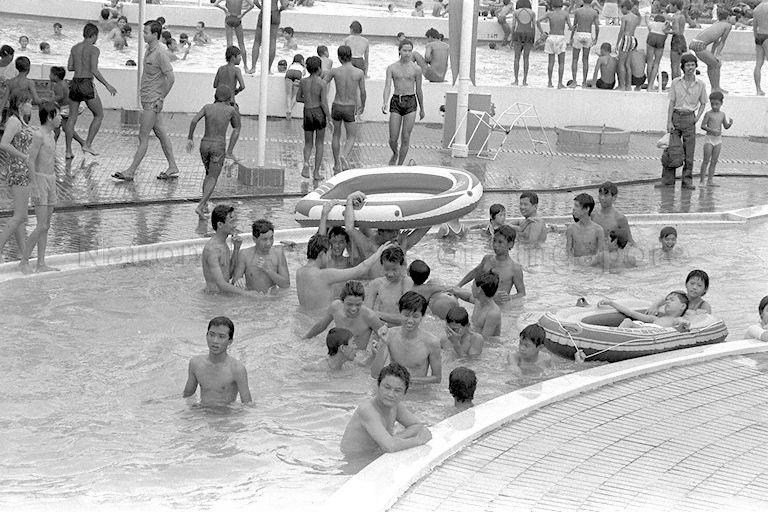 VISITORS AT THE "BIG SPLASH" SWIMMING COMPLEX IN THE EAST