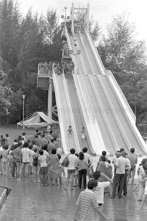 VISITORS AT THE "BIG SPLASH" SWIMMING COMPLEX IN THE EAST