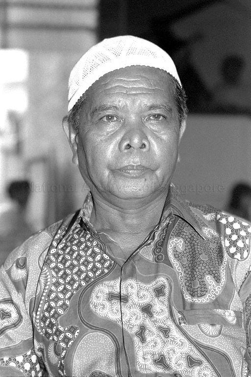 Syane Kejan, 60, receives a watch in appreciation of his 43-