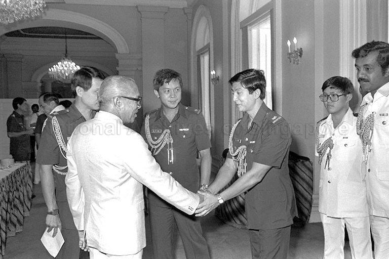 President Devan Nair shaking hands with newly appointed