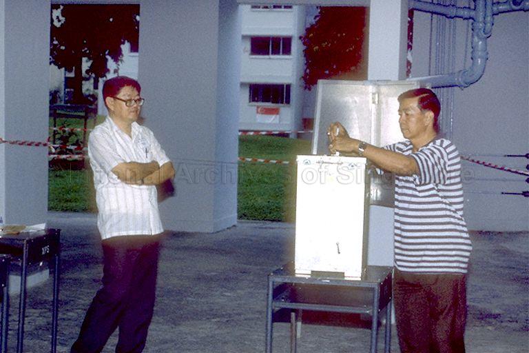 1998 General Election - Voter slipping ballot card into