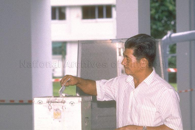 1998 General Election - Voter slipping ballot card into