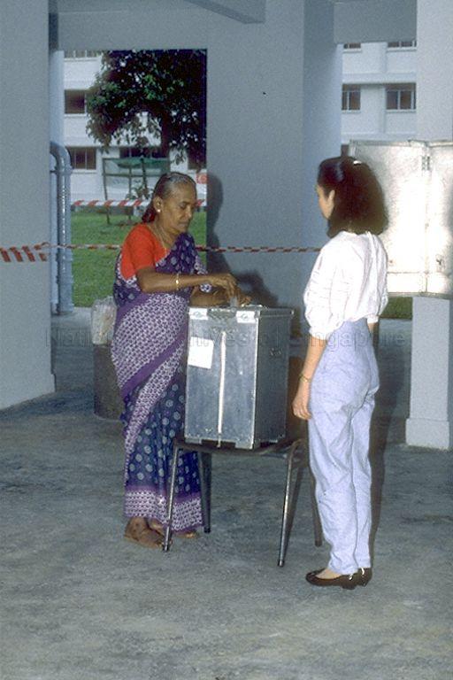 1998 General Election - Voter slipping ballot card into