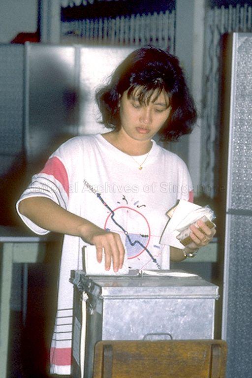 1998 General Election - Voter places her ballot slip into