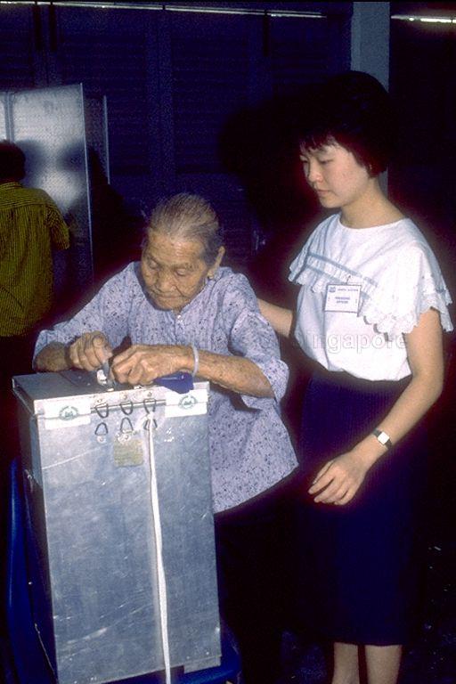 1998 General Election - Voter slipping ballot card into