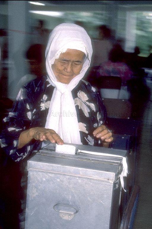 1998 General Election - Voter slipping ballot card into