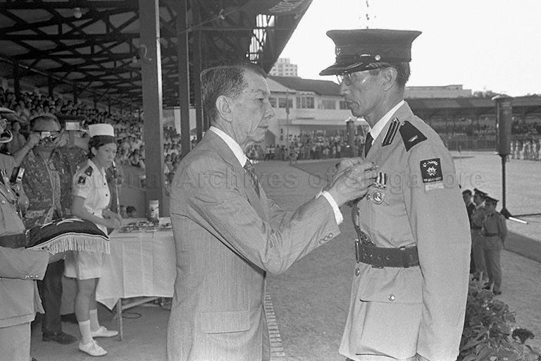 President Dr Benjamin Henry Sheares presenting awards during