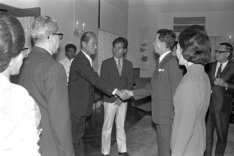 President Dr Benjamin Sheares greeting a guest during a
