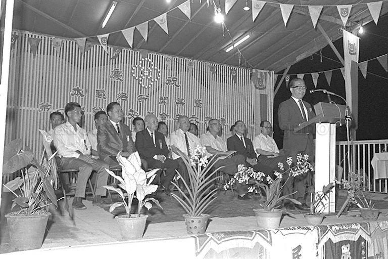 MINISTER FOR THE INTERIOR AND DEFENCE LIM KIM SAN (SEATED,