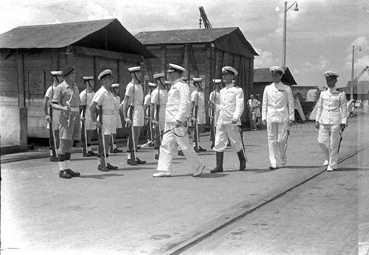 Flag Officer, Malaya, Rear Admiral H J Egerton inspecting