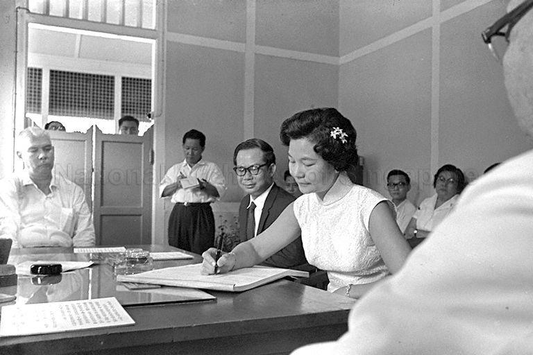 Deputy Prime Minister Dr Toh Chin Chye looks on as his bride