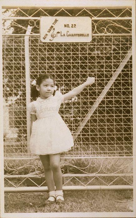 Patricia Goh, daughter of Goh Soon Tioe at the front gate of