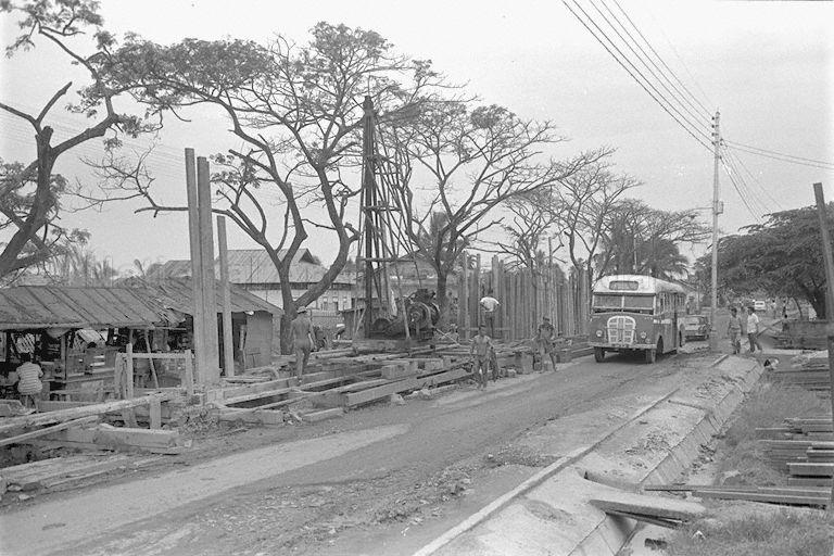 Trench timbering of a narrow, cut and fill trench beside a