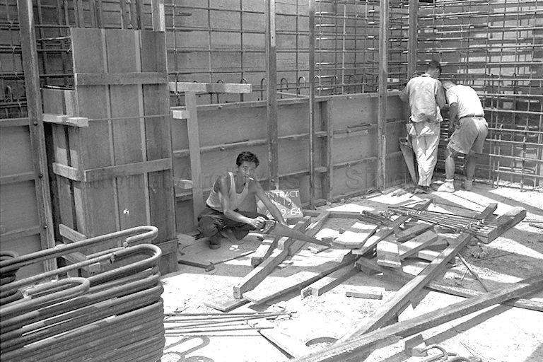 Public Works Department (PWD) worker preparing formwork for