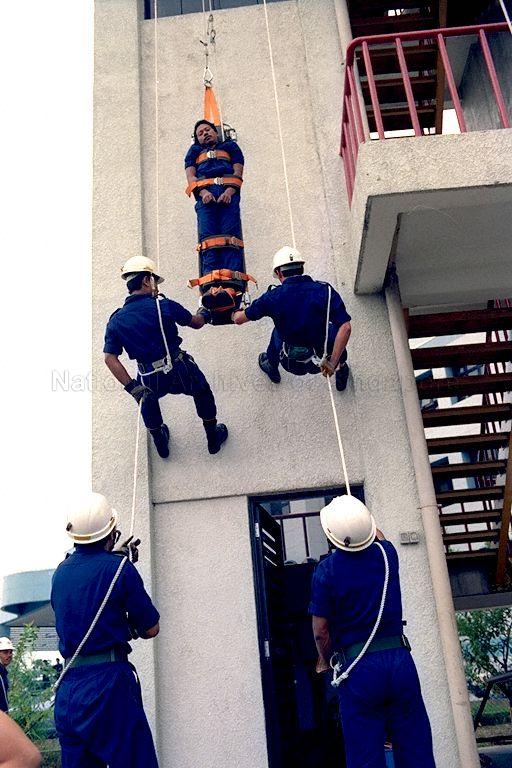 Display in bringing an "injured victim", who is strapped to
