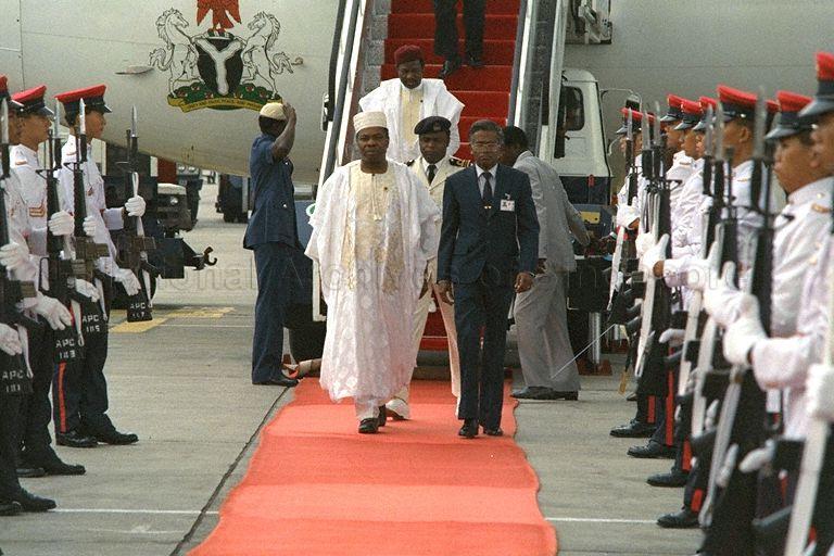 President of Sierra Leone Dr Joseph S Momoh (left, white