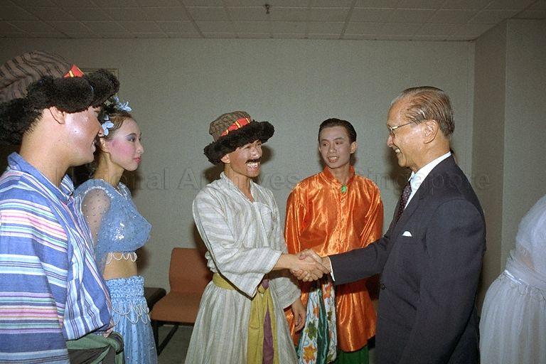 President Wee Kim Wee greeting performers during opening