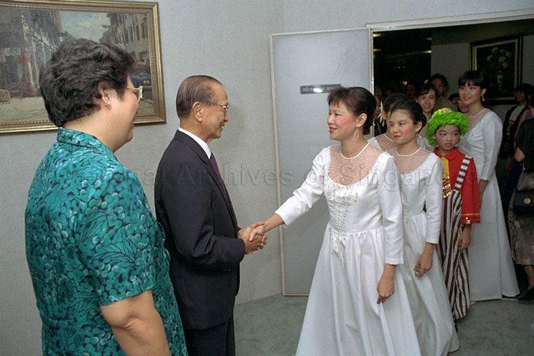 President Wee Kim Wee greeting performers during the opening