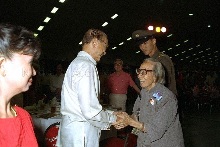 President Wee Kim Wee being greeted by an elderly woman as