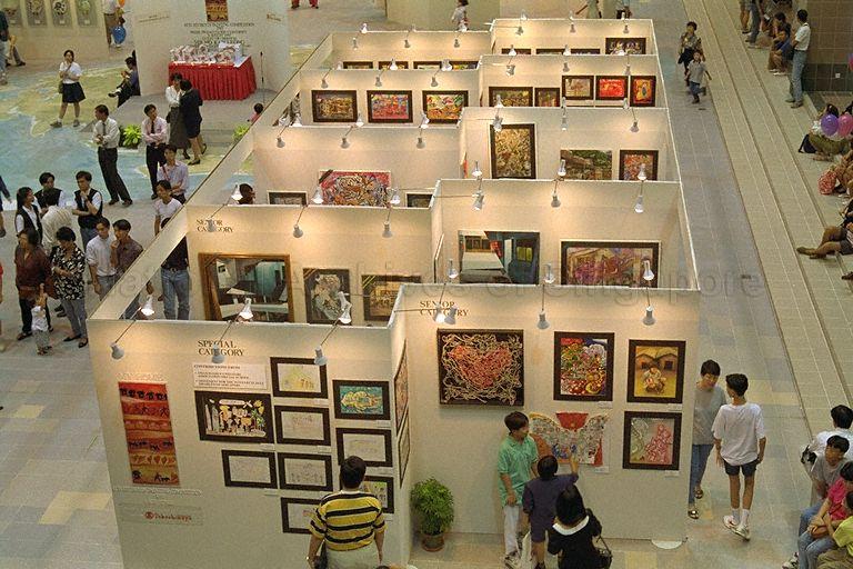 Visitors viewing entries of student painting competition,