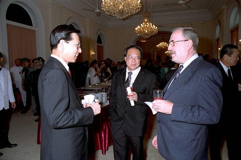 President Ong Teng Cheong (left) talking with a guest and a