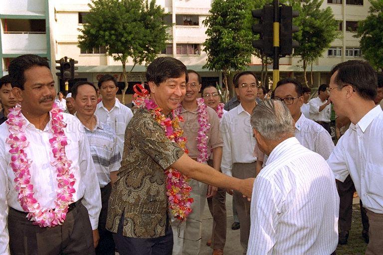 Minister without Portfolio Lim Boon Heng (second from left)