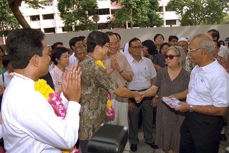 Minister without Portfolio Lim Boon Heng (garlanded)