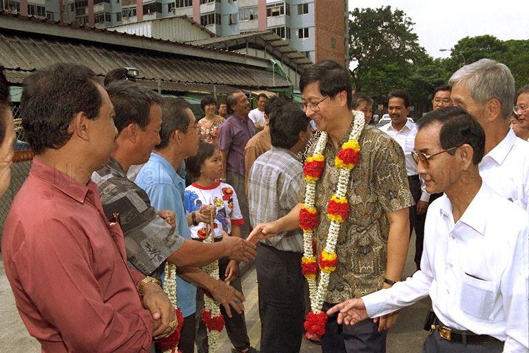 Minister without Portfolio Lim Boon Heng (garlanded)