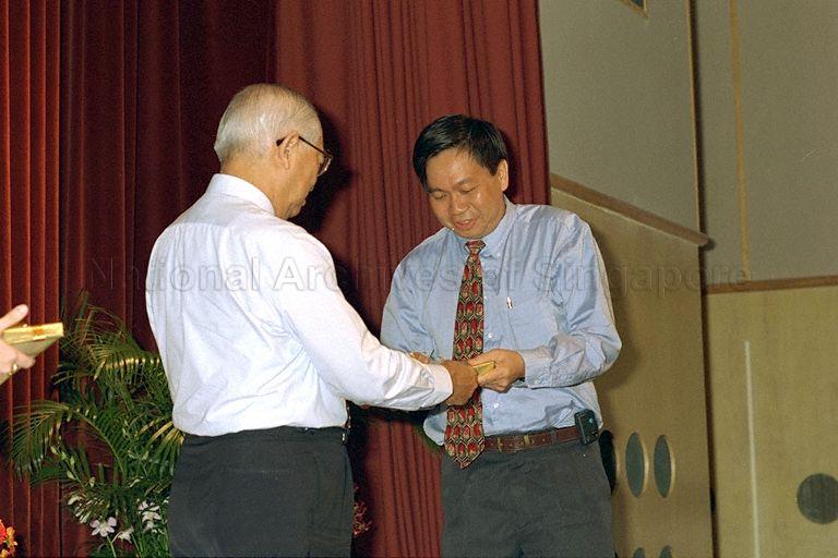 Minister for Finance Dr Richard Hu Tsu Tau (back to camera)