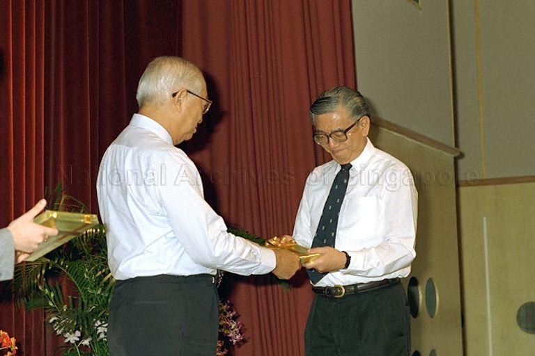 Minister for Finance Dr Richard Hu Tsu Tau (left) presenting