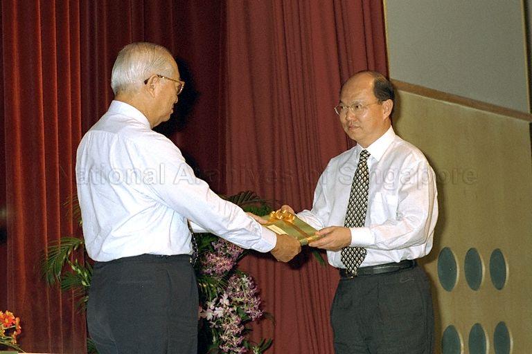 Minister for Finance Dr Richard Hu Tsu Tau (left) presenting