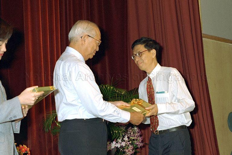 Minister for Finance Dr Richard Hu Tsu Tau (left) presenting