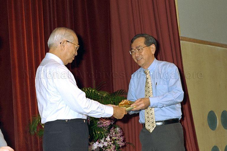 Minister for Finance Dr Richard Hu Tsu Tau (left) presenting