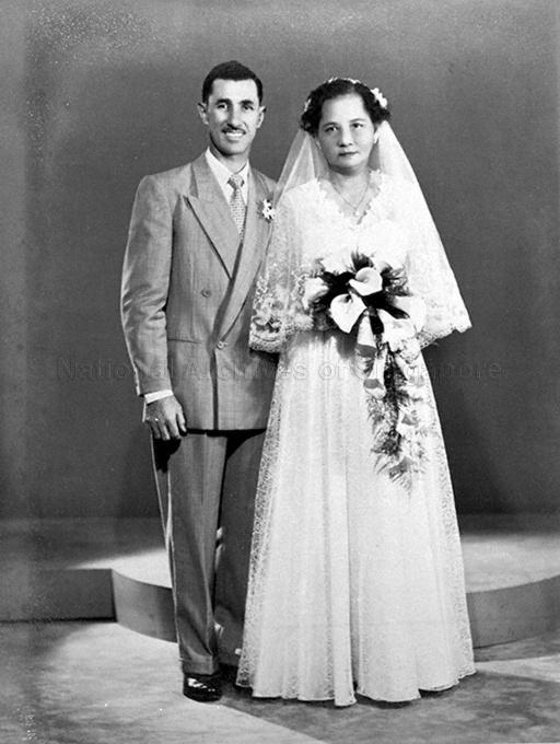PORTRAIT OF A EURASIAN WEDDING COUPLE, AT STRAITS