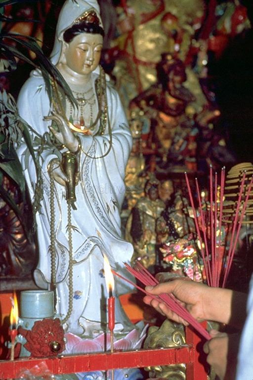 Medium (tangki) performing ritual at the altar in a Taoist