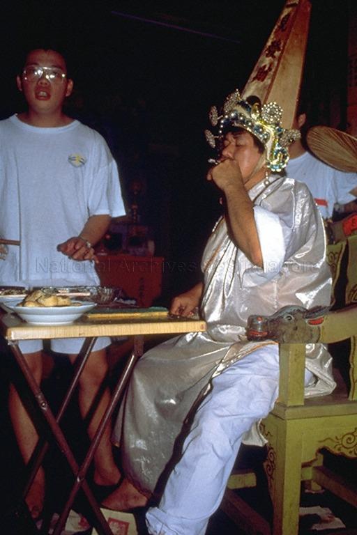Medium (tangki) in a trance during ritual at Taoist temple