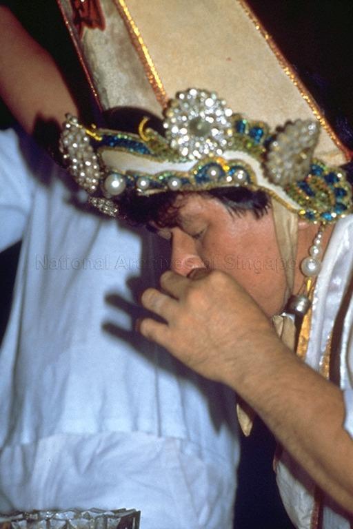 Medium (tangki) in a trance during ritual at Taoist temple