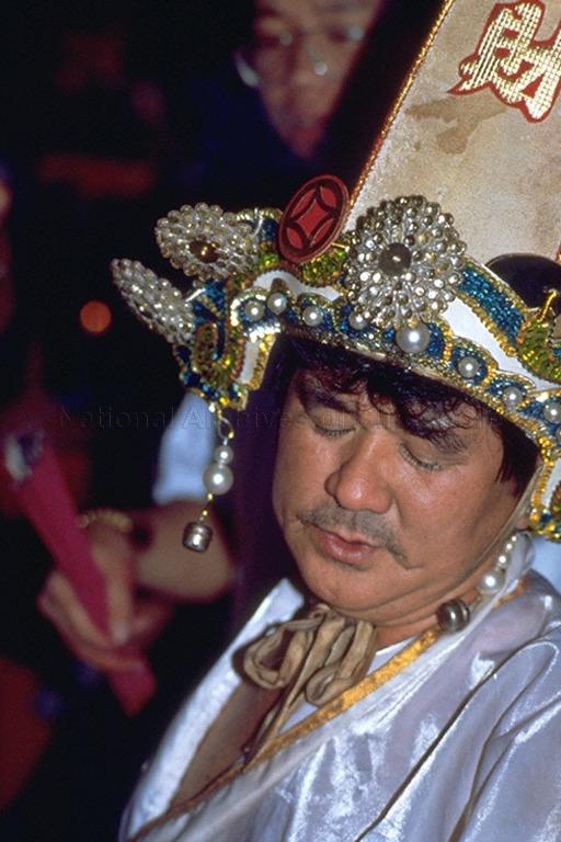 Medium (tangki) in a trance during ritual at Taoist temple
